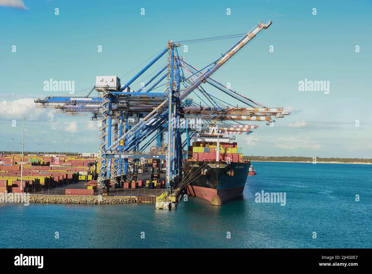 The container vessel during discharging at an industrial port and move ...