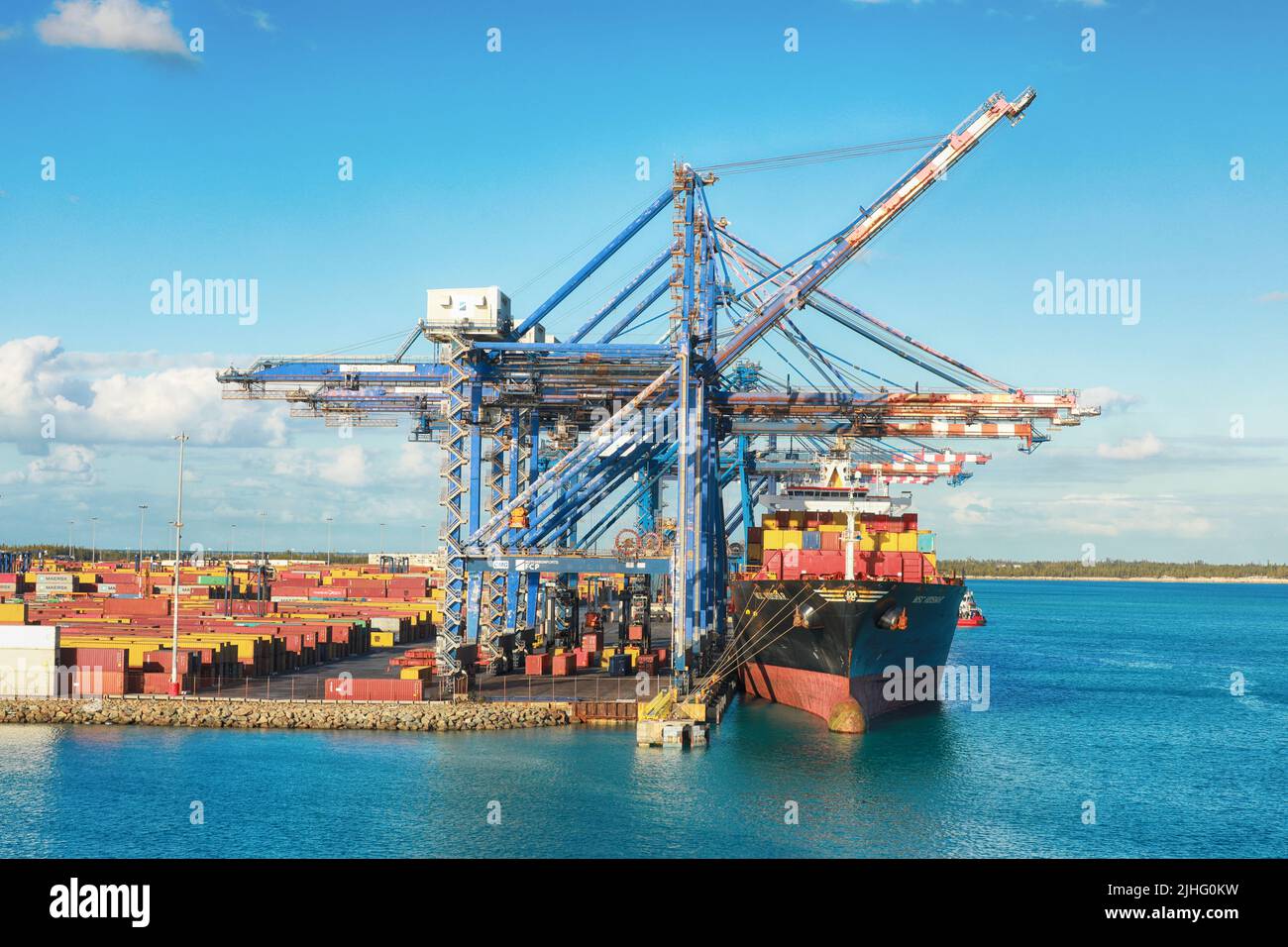 The container vessel during discharging at an industrial port and move ...