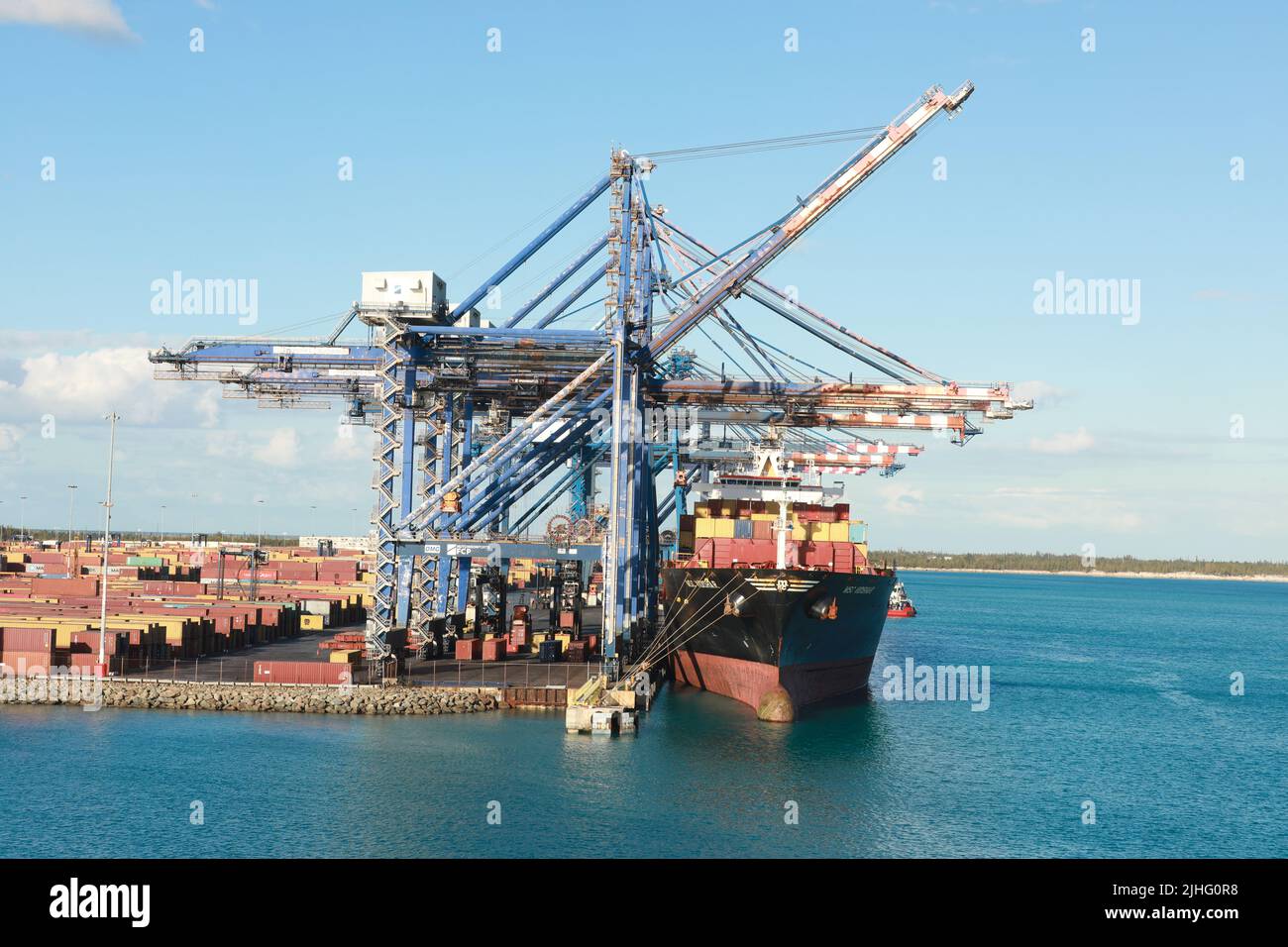 The container vessel during discharging at an industrial port and move ...