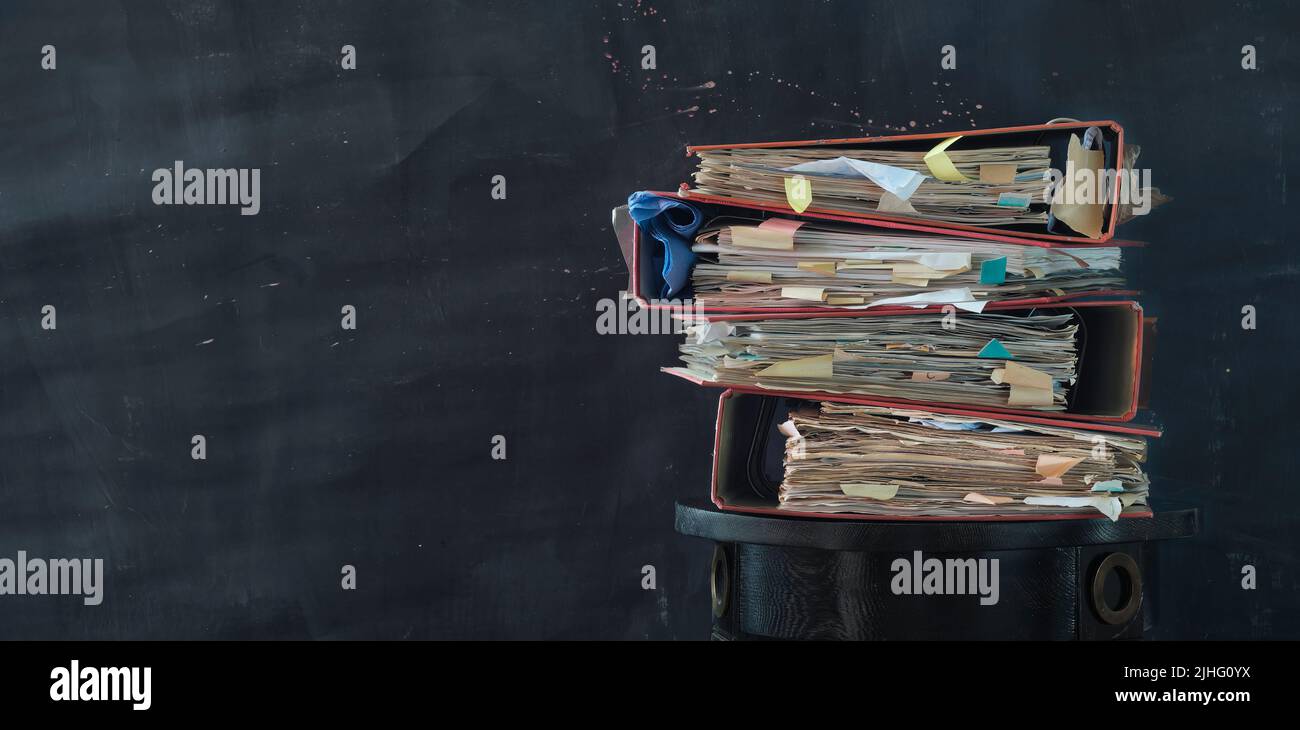 Heap of messy file folders,red tape, bureaucracy,aministration,business ...