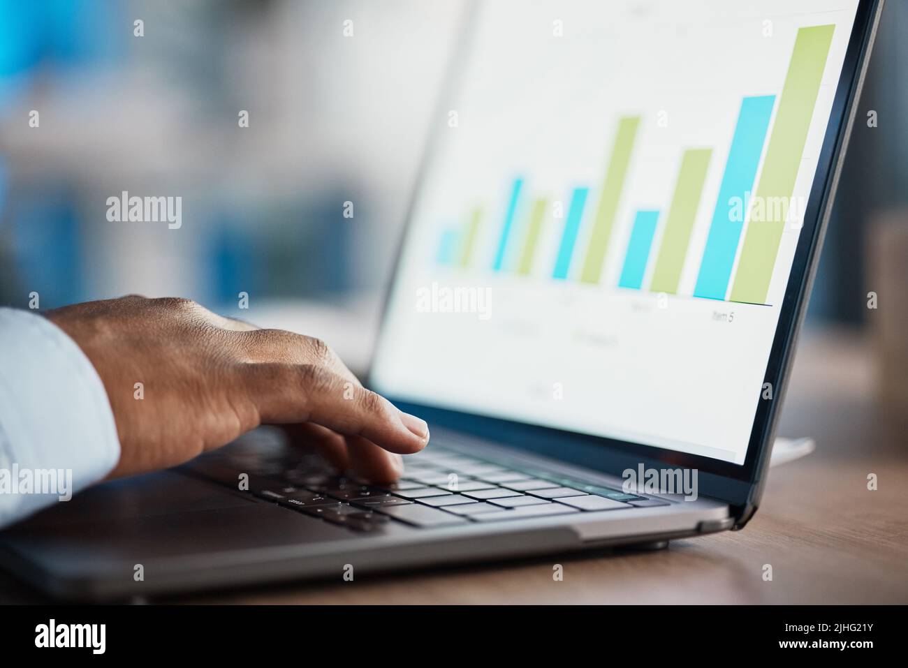 Closeup hands of african man working on a laptop. African american ...