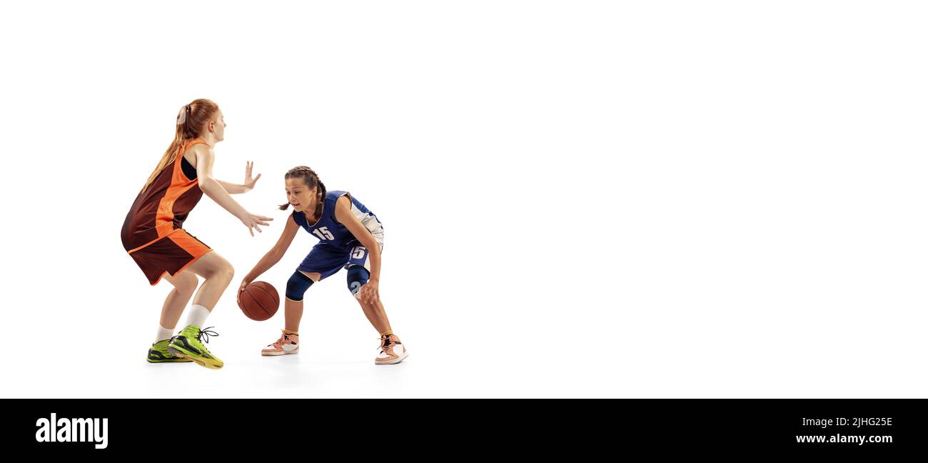 Play defense. Two basketball players, young girls, teen training with ...