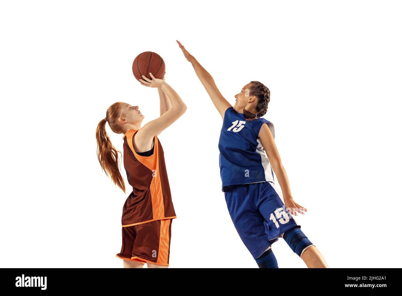 Studio shot of beginner basketball players, young girls, teen training ...