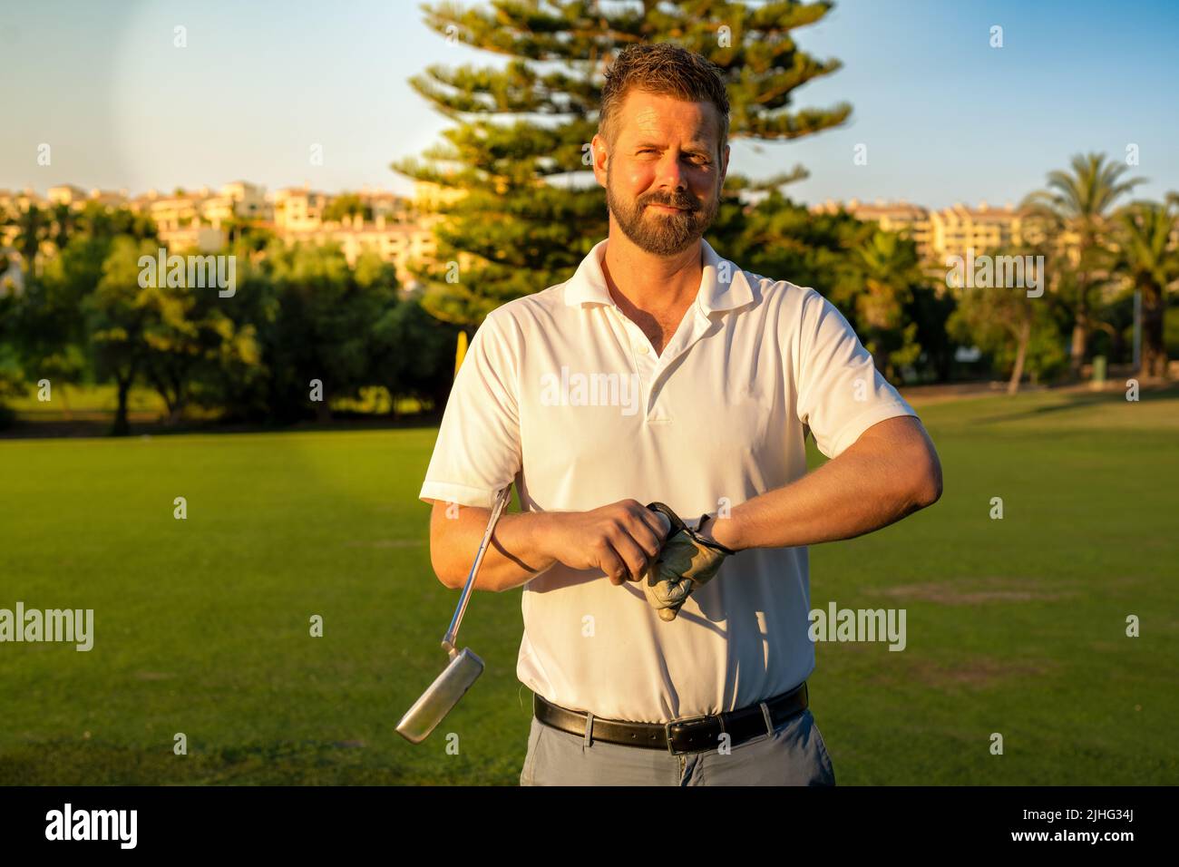 Concentrated golf player hitting ball hi-res stock photography and ...