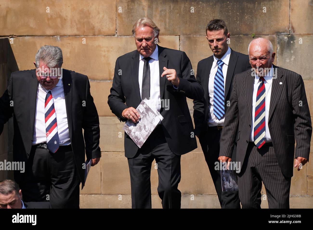 Former Rangers player Alan Rough (centre) leaves the church after the ...