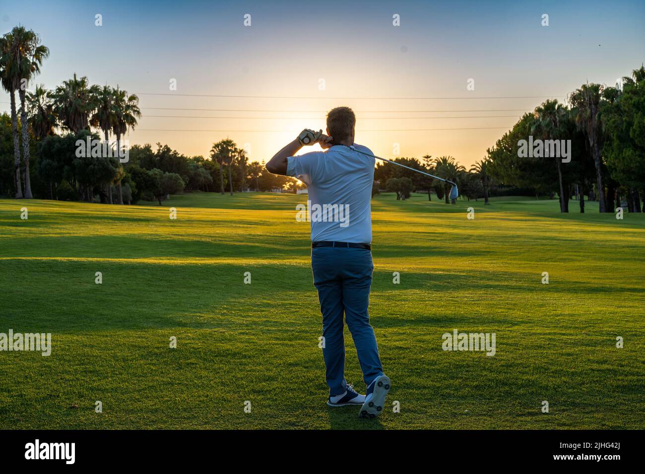 Good strike, professional golfer looking trajectory of the ball, golfer ...
