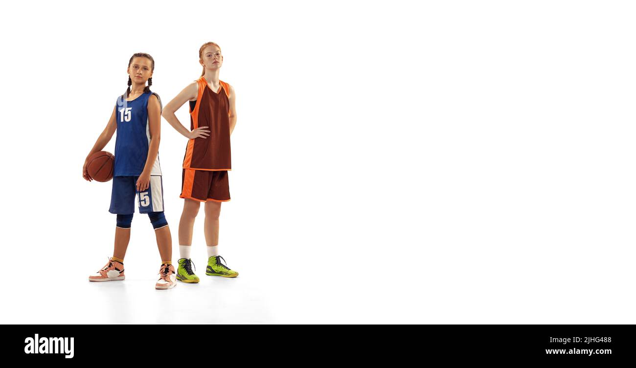 Studio shot of beginner basketball players, young girls, teen training ...