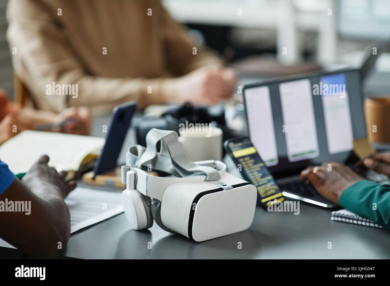 Close-up of team of programmers testing new interface of virtual ...