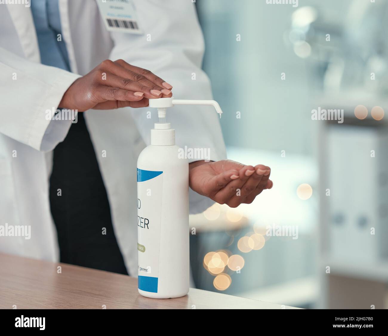 Healthcare professional cleaning their hands in the office. Doctor ...