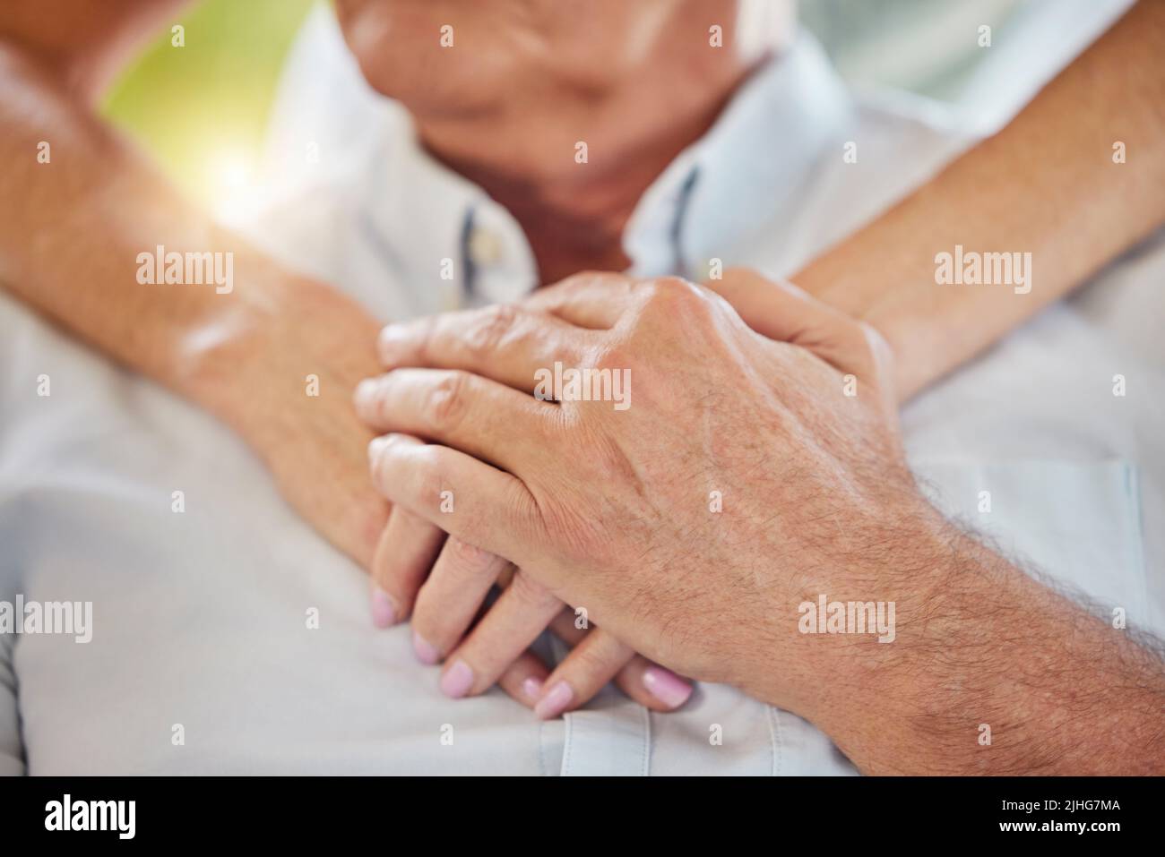 Closeup doctor holding hands on patients chest showing support during ...