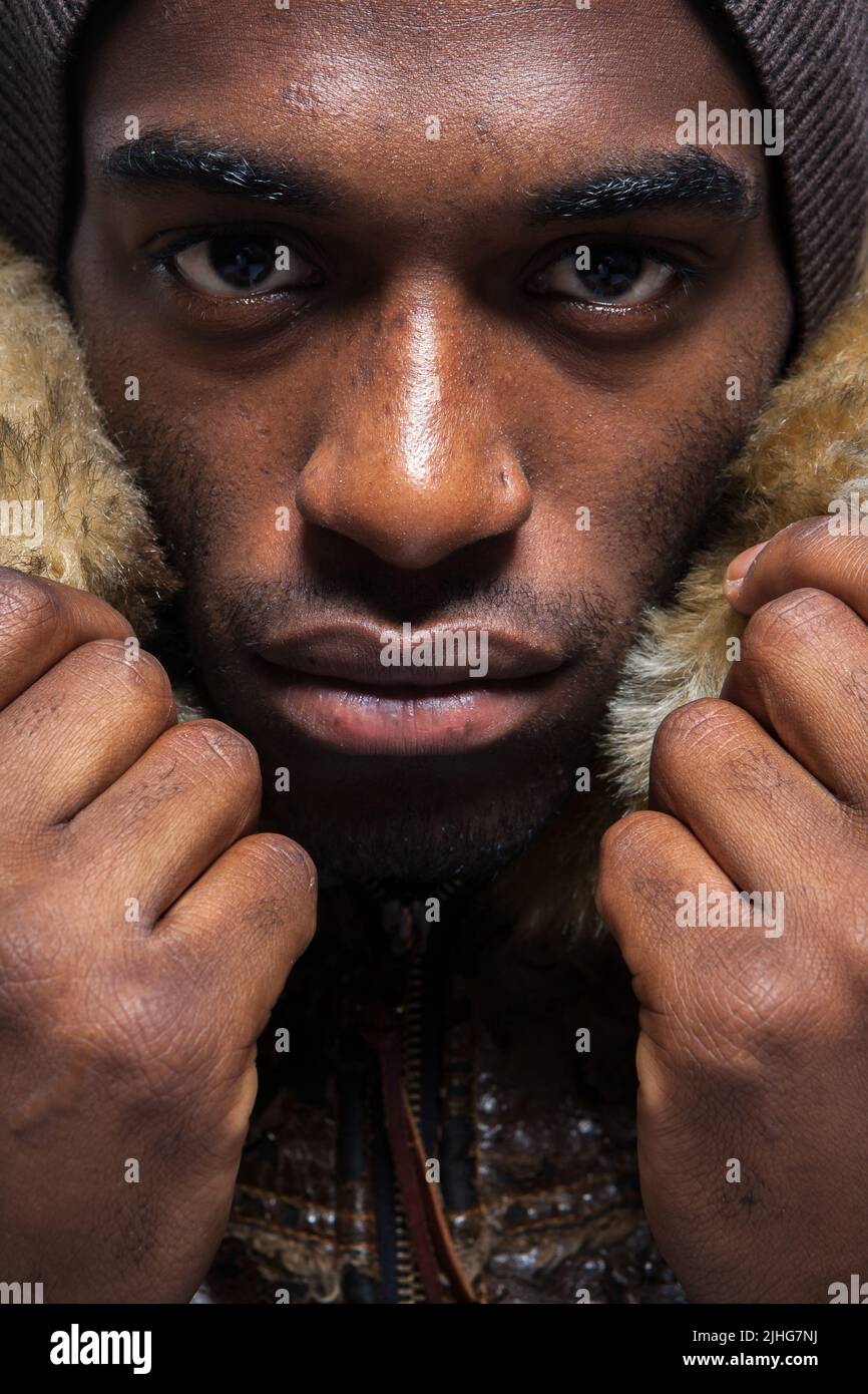 Urban male. Close up, eye contact and a confident expression from a ...