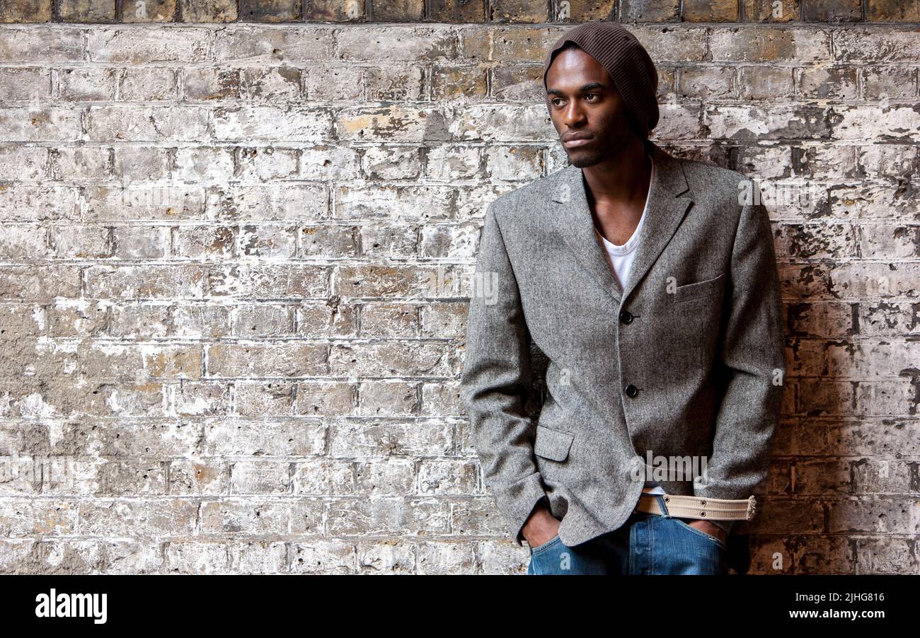 Street Casual. A casually dressed urban character candidly relaxed in ...