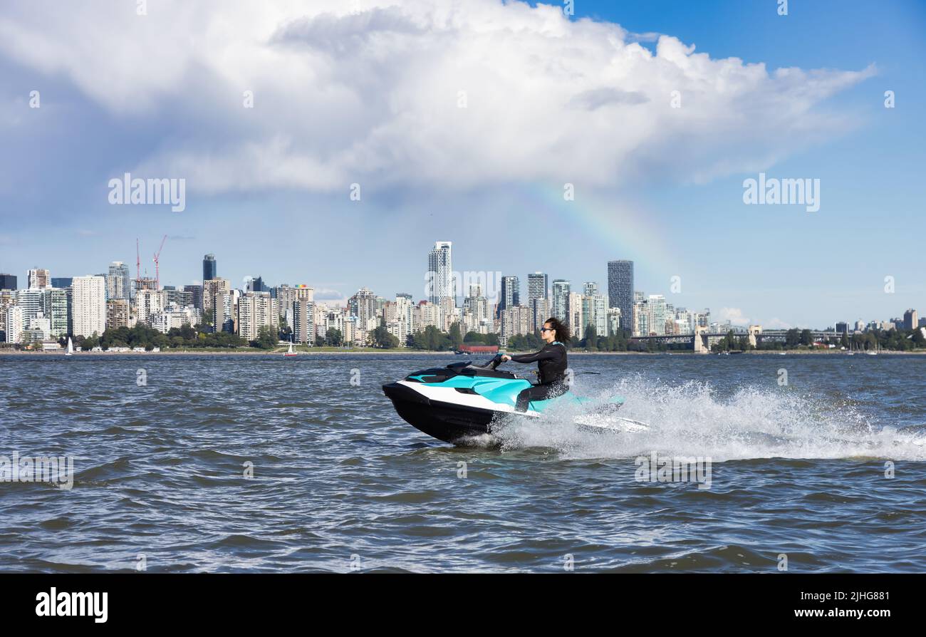 Adventurous Caucasian Woman on Sea-Doo riding in the Ocean Stock Photo ...