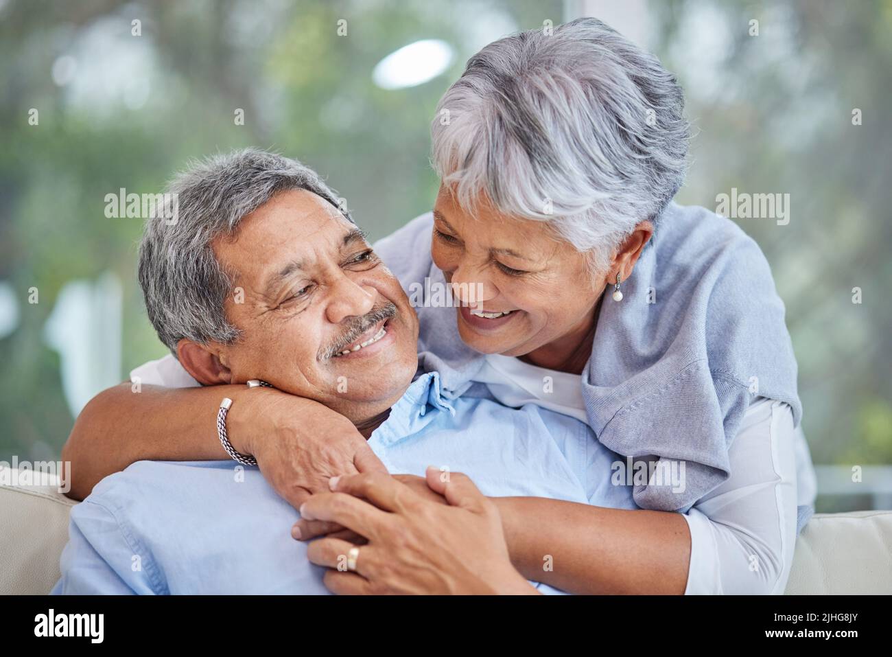Closeup Of An Affectionate Mixed Race Senior Couple Relaxing In Their