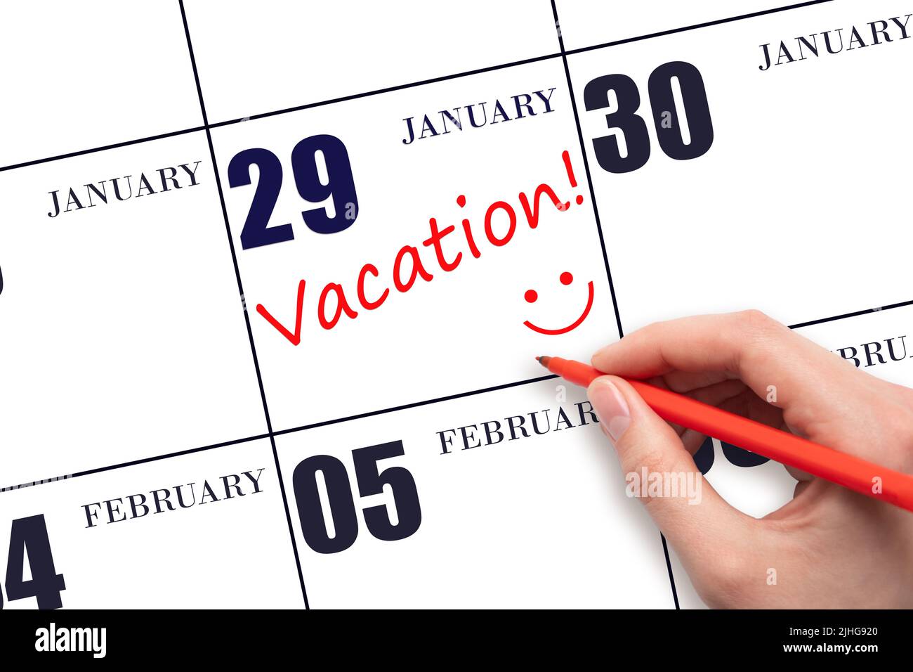 29th day of January. A hand writing a VACATION text and drawing a ...