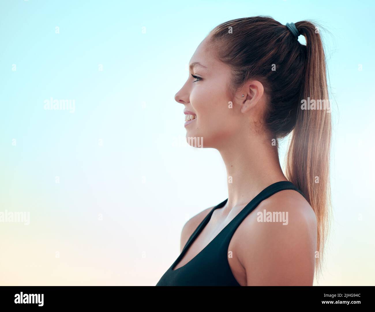 Beautiful woman practising yoga exercise on the beach. Young female ...