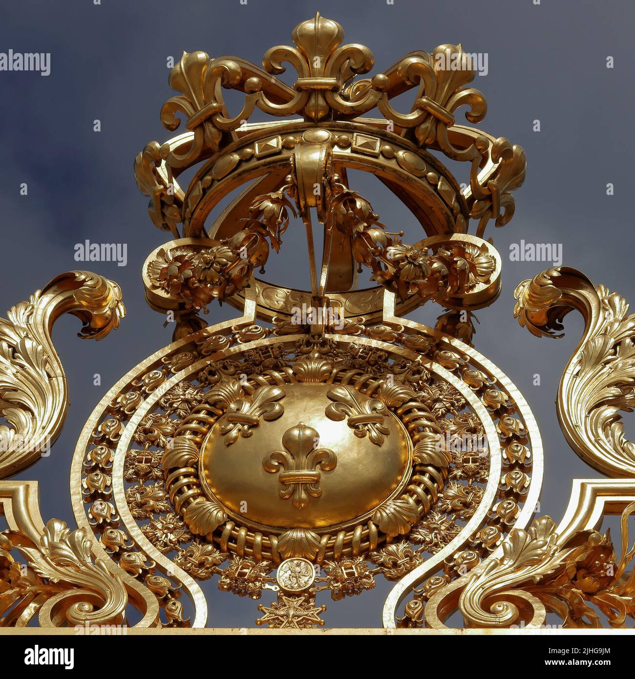 Elements of golden gates decorations at Versailles in Paris, France ...