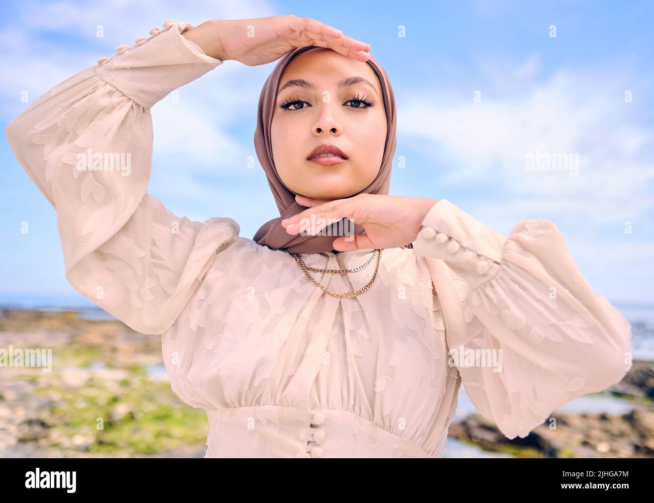 Beautiful young arab woman posing outdoors in a headscarf. Attractive ...