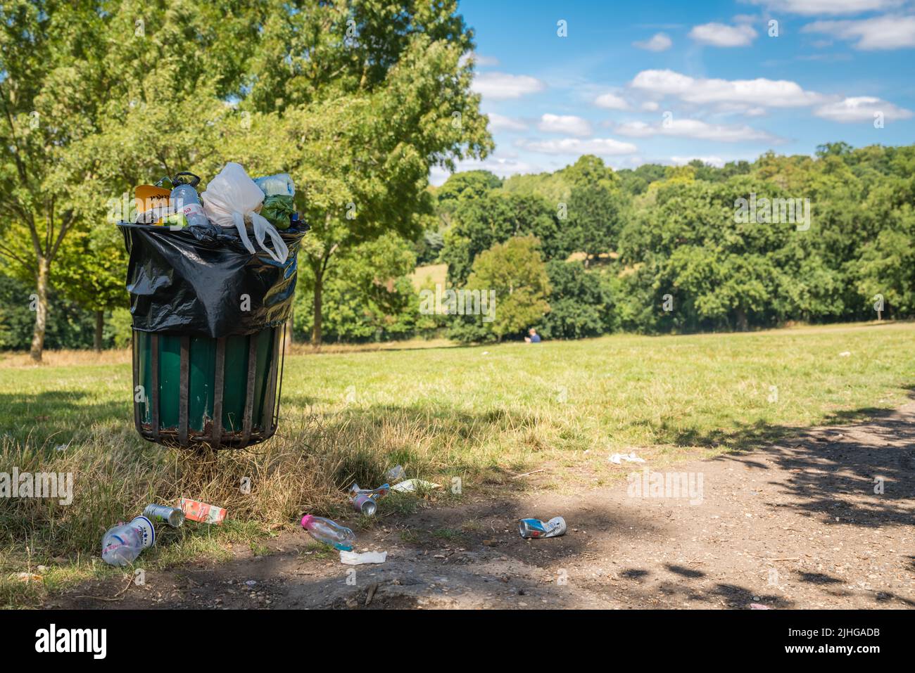London, UK - July 2020 : Overflowing large rubbish and litter garbage ...