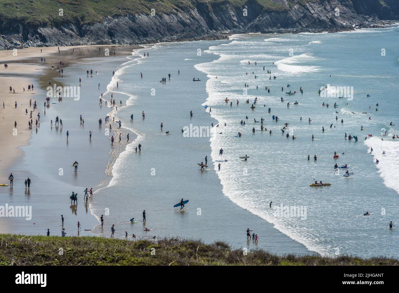 Tenby, Wales - May 2021 : Crowds of people swimming, sunbathing and ...
