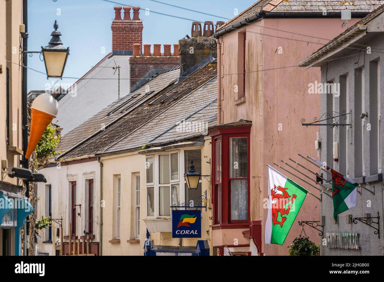 Tenby, Wales - May 2021 : Welsh flag among colorful homes in a ...