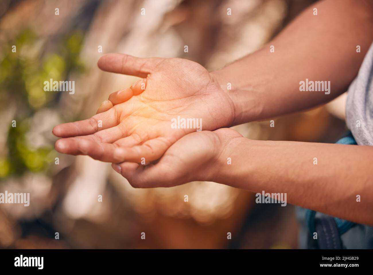 Above shot of a caucasian man suffering with cramp in his hand while ...