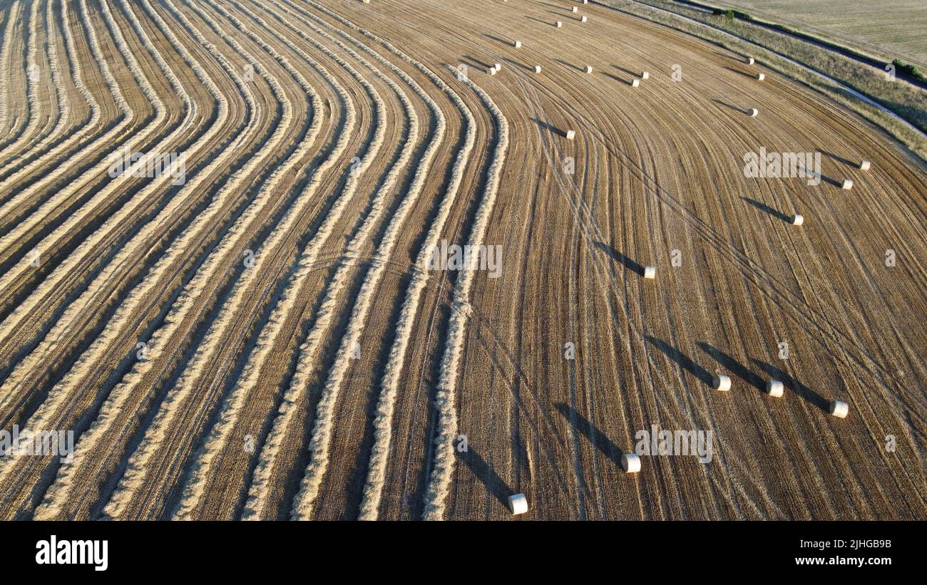 Aerial views of Hay bales in field with neat lines Stock Photo - Alamy