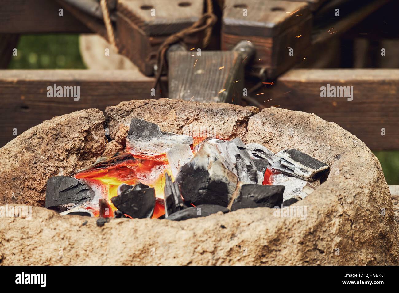 Work of a medieval blacksmith for the manufacture of metal products ...