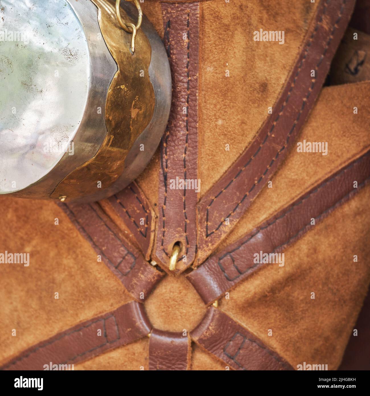 An ancient Roman flask and a vintage leather hiking bag. Reconstruction ...