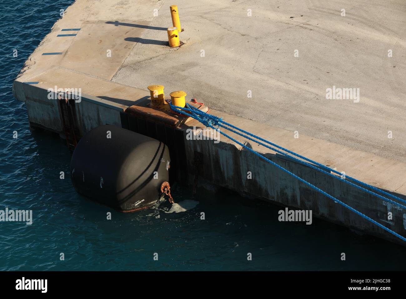 Black rubber inflatable ship fenders Stock Photo - Alamy
