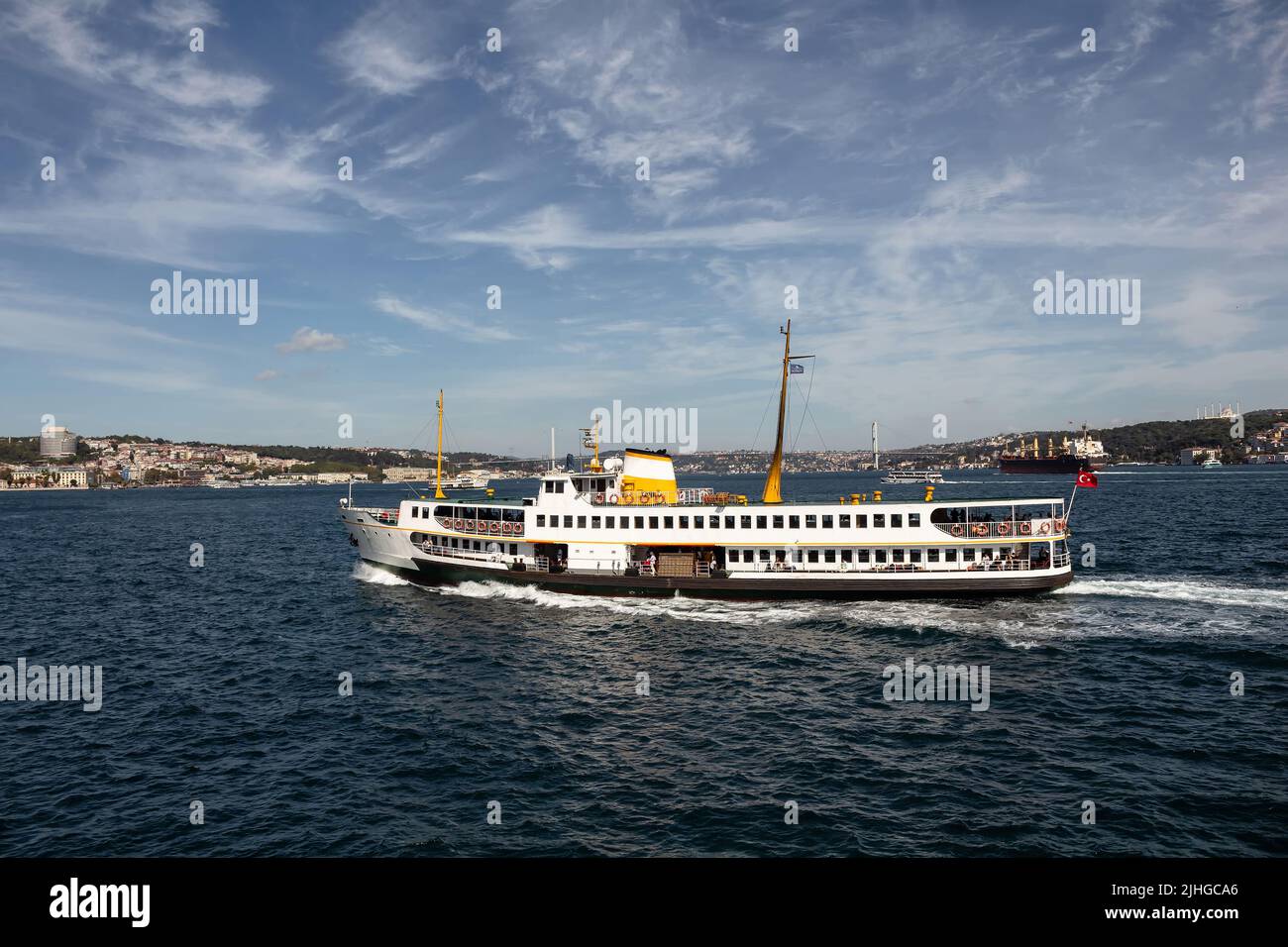 View of traditional ferry boat on Bosphorus in Istanbul. It is a sunny ...