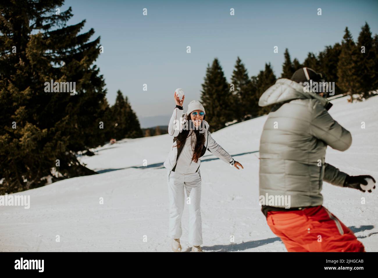 Two people snowball fight on hi-res stock photography and images - Alamy