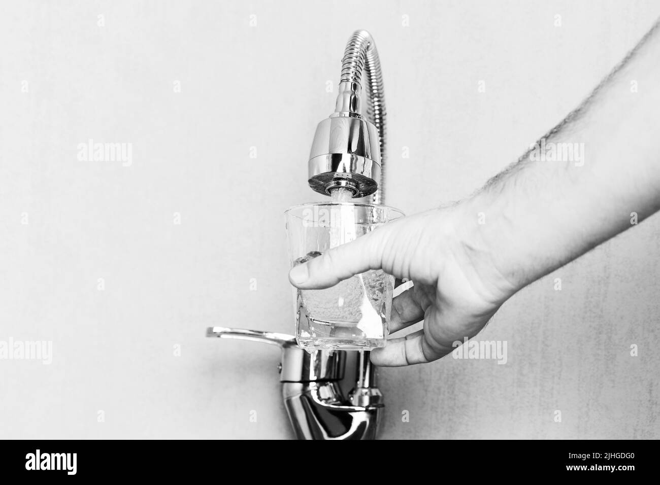 Hand holding water flowing from Black and White Stock Photos & Images ...