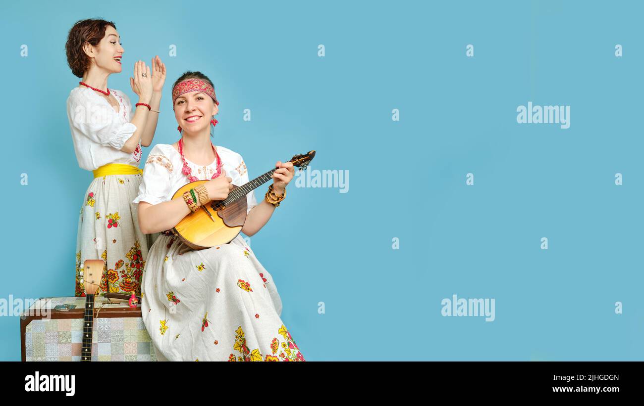 Women musicians in Russian folk dresses with musical instruments on a ...