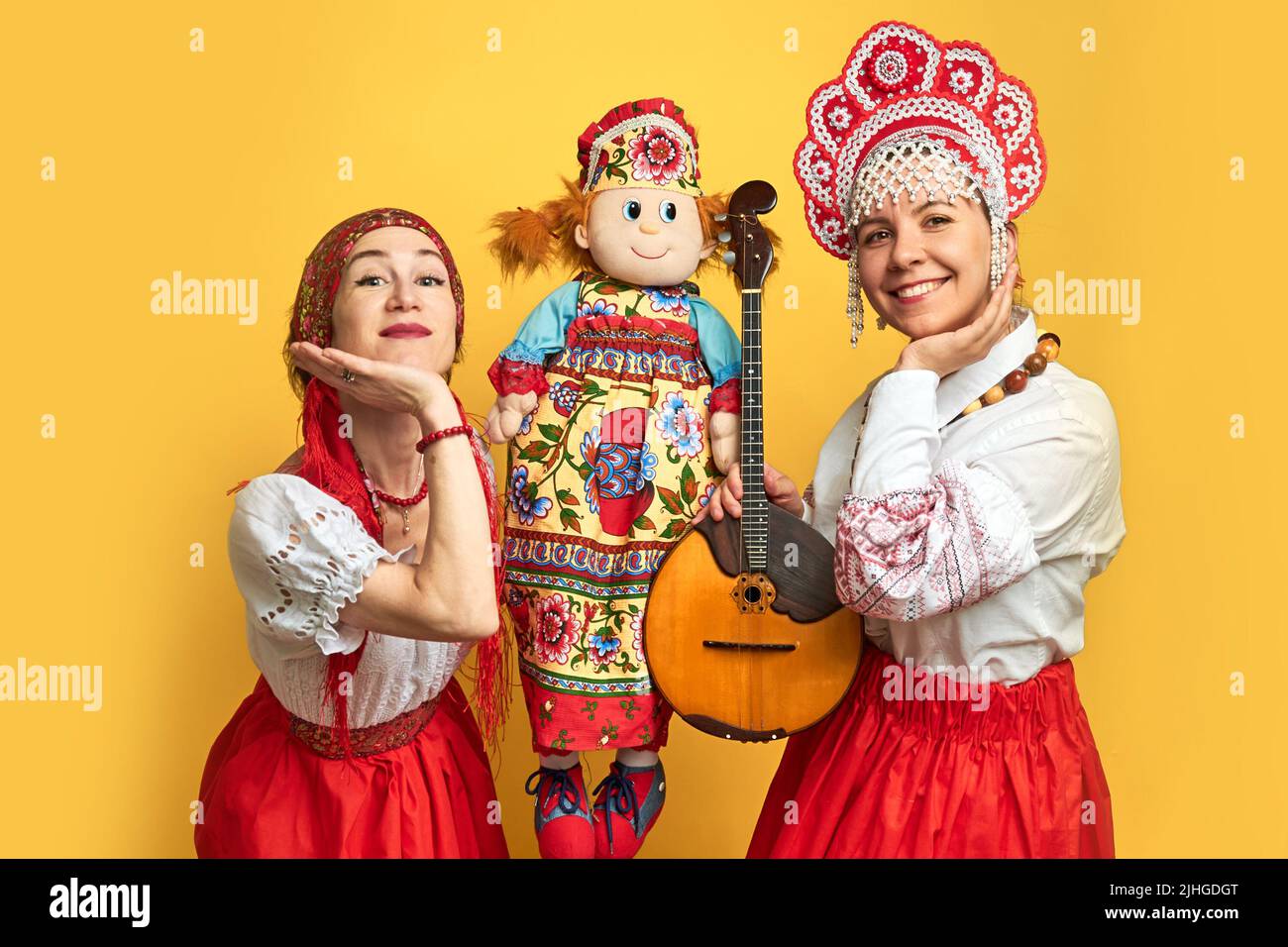 Women musicians in Russian folk dresses with musical instruments on a ...