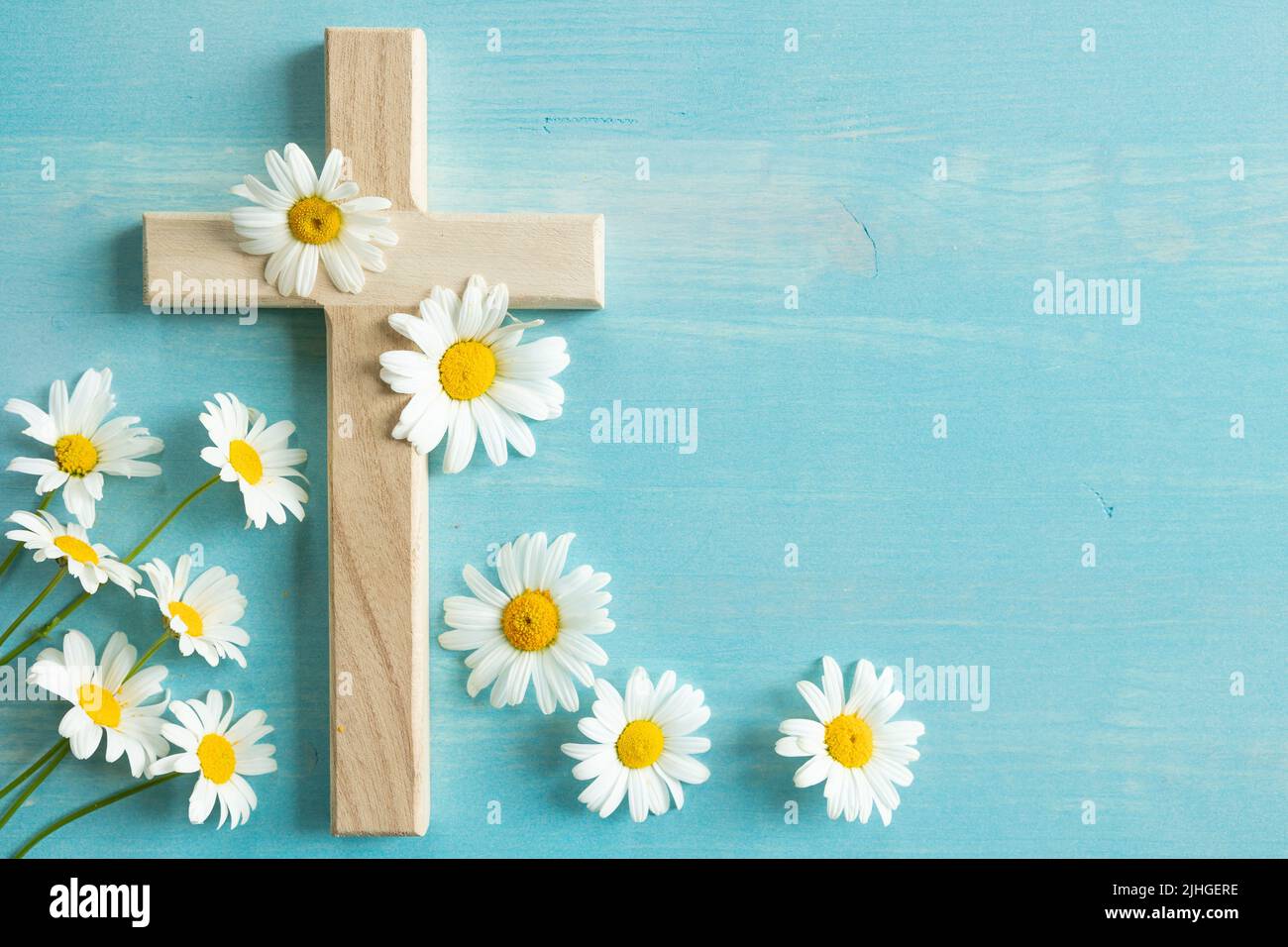 Simple wood Christian cross on a blue wood background with border of ...