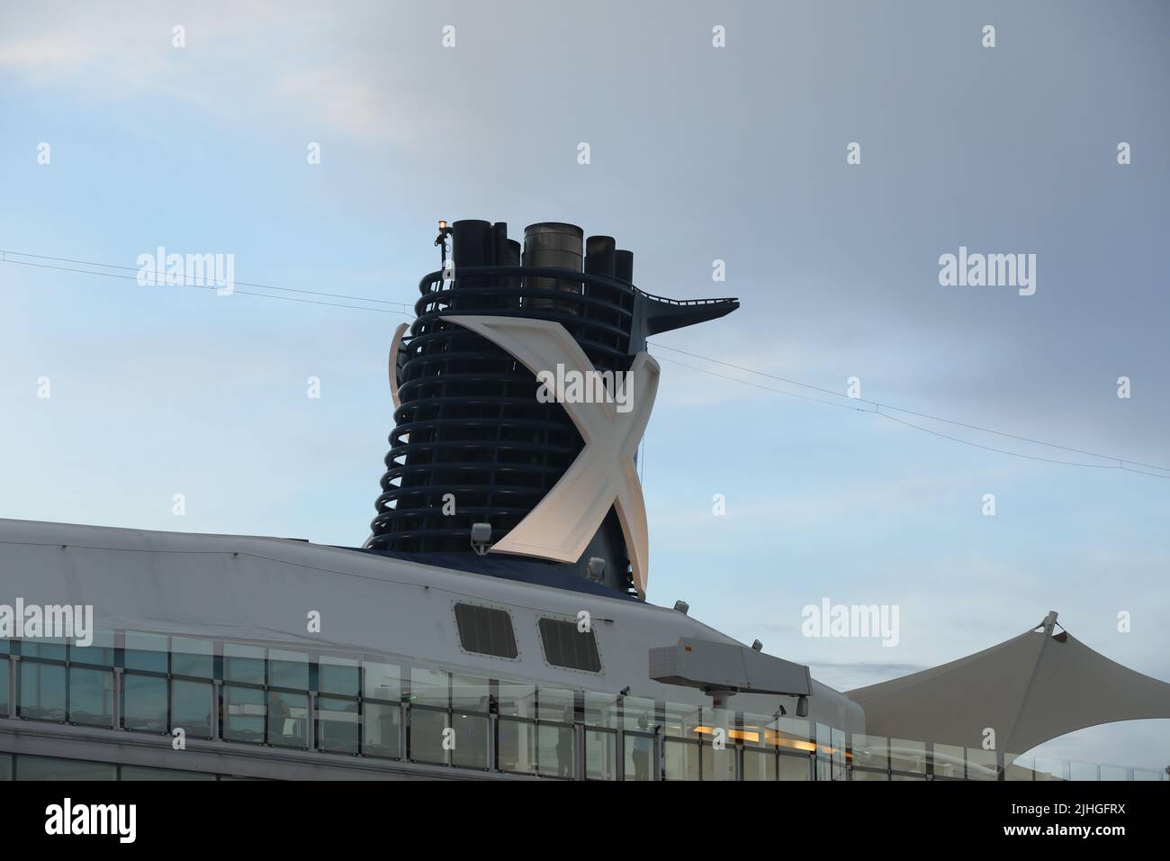 The large X on the smoke stack is the logo for Celebrity Cruise Lines ...