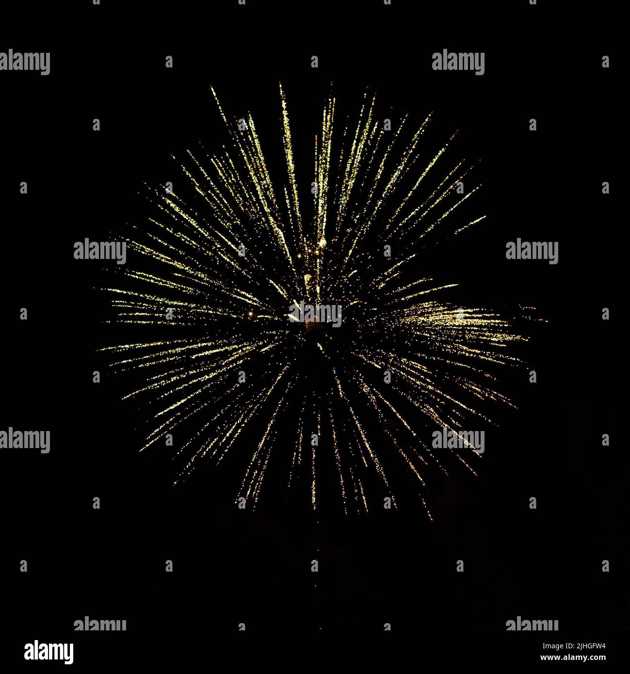 Bright fireworks with a sphere or circle shape exploding against black ...
