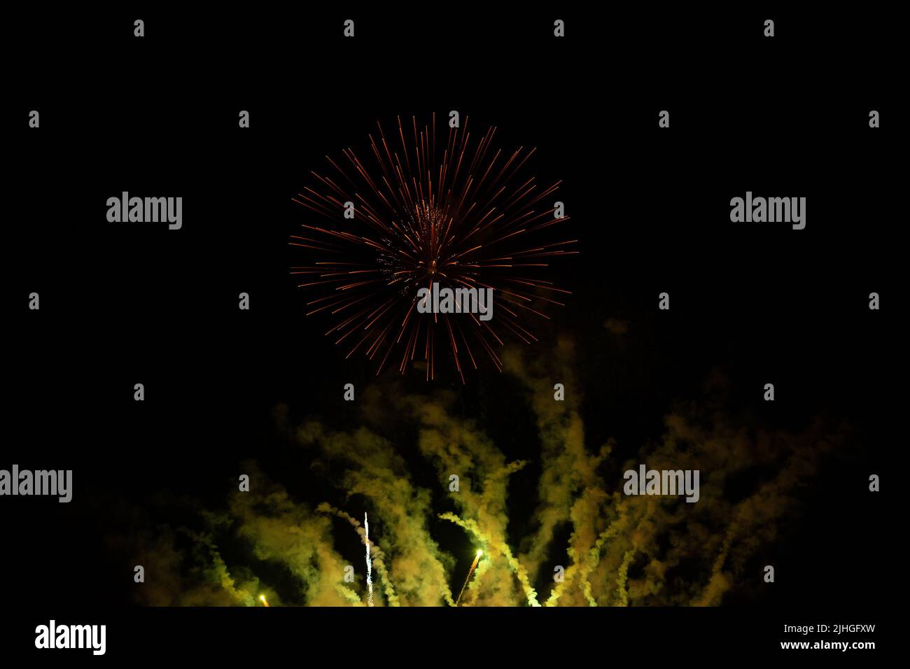 Loud fireworks being launched against black background, can be used as ...