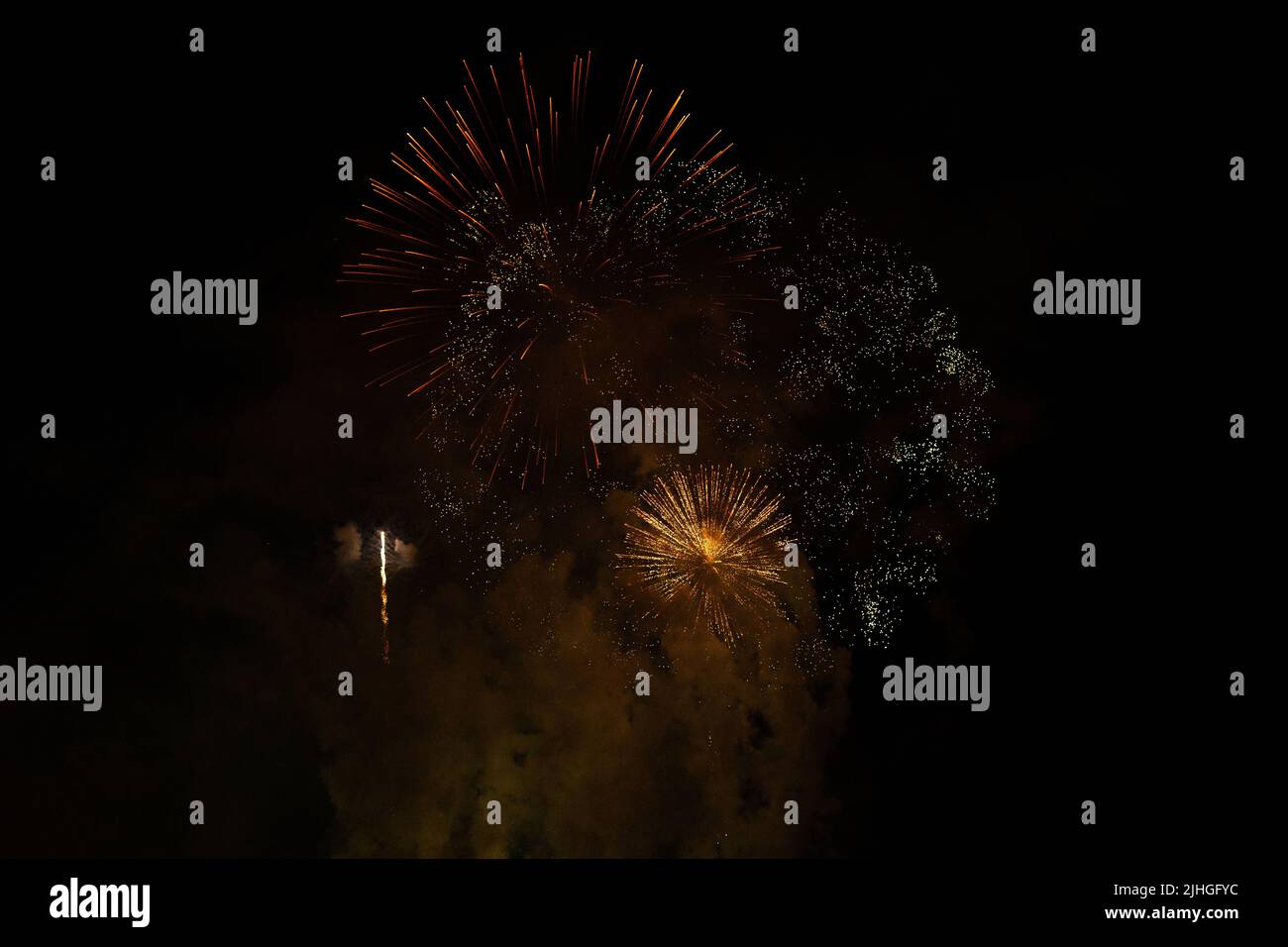 Loud fireworks exploding against black background, can be used as an ...