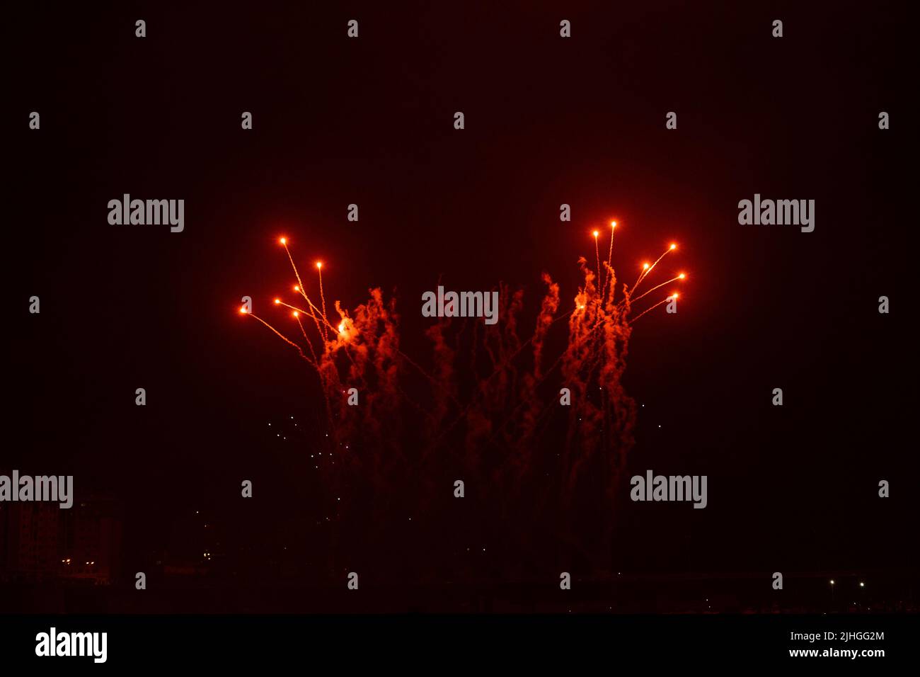 Loud fireworks being launched against black background, can be used as ...