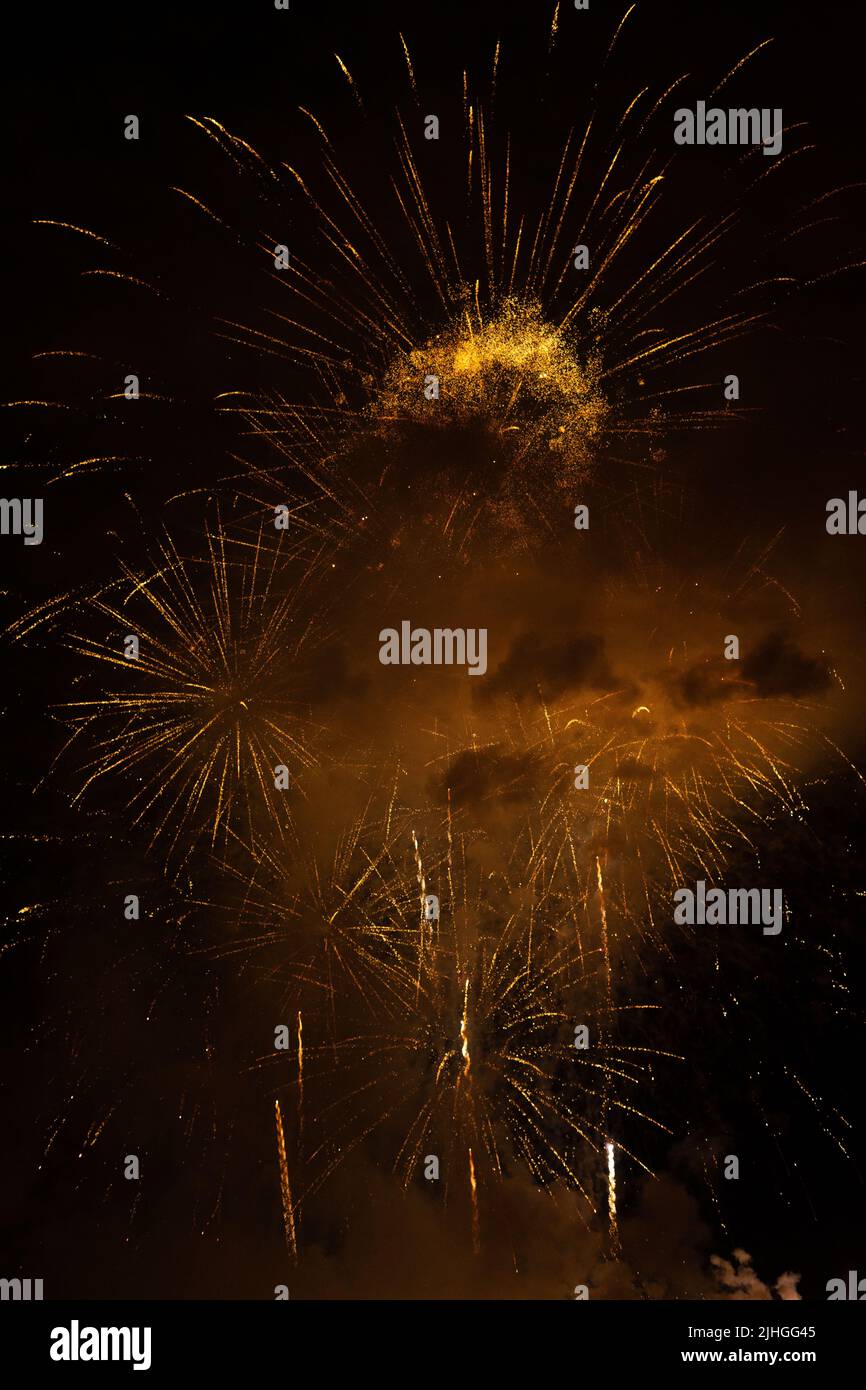 Fireworks exploding behind the smoke against black background Stock ...