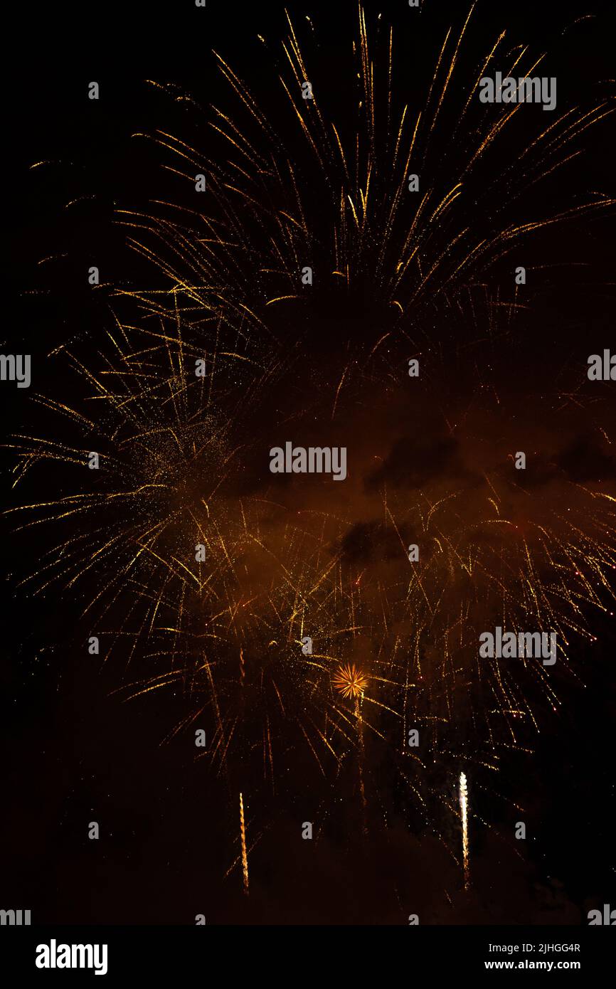 Fireworks exploding behind the smoke against black background Stock ...