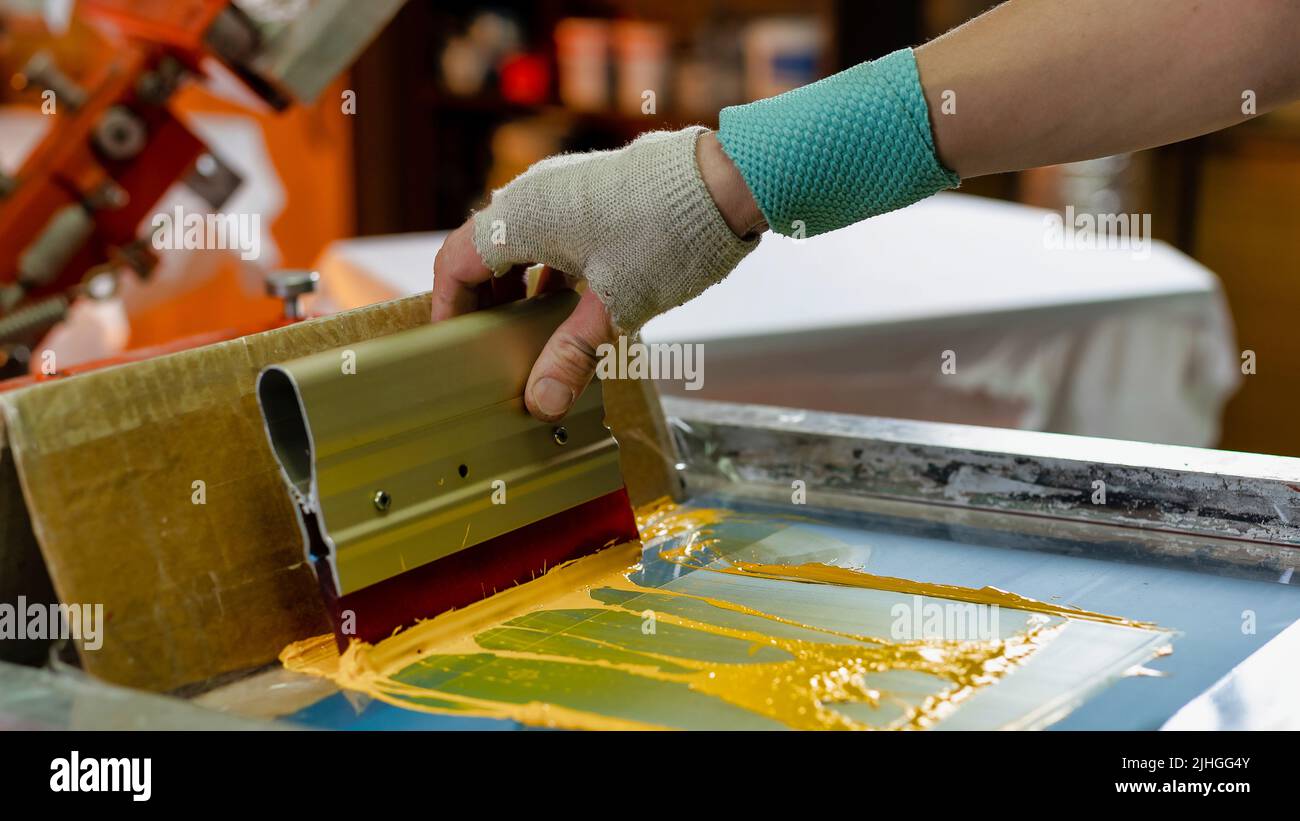 Hand pressing silk screen hi-res stock photography and images - Alamy