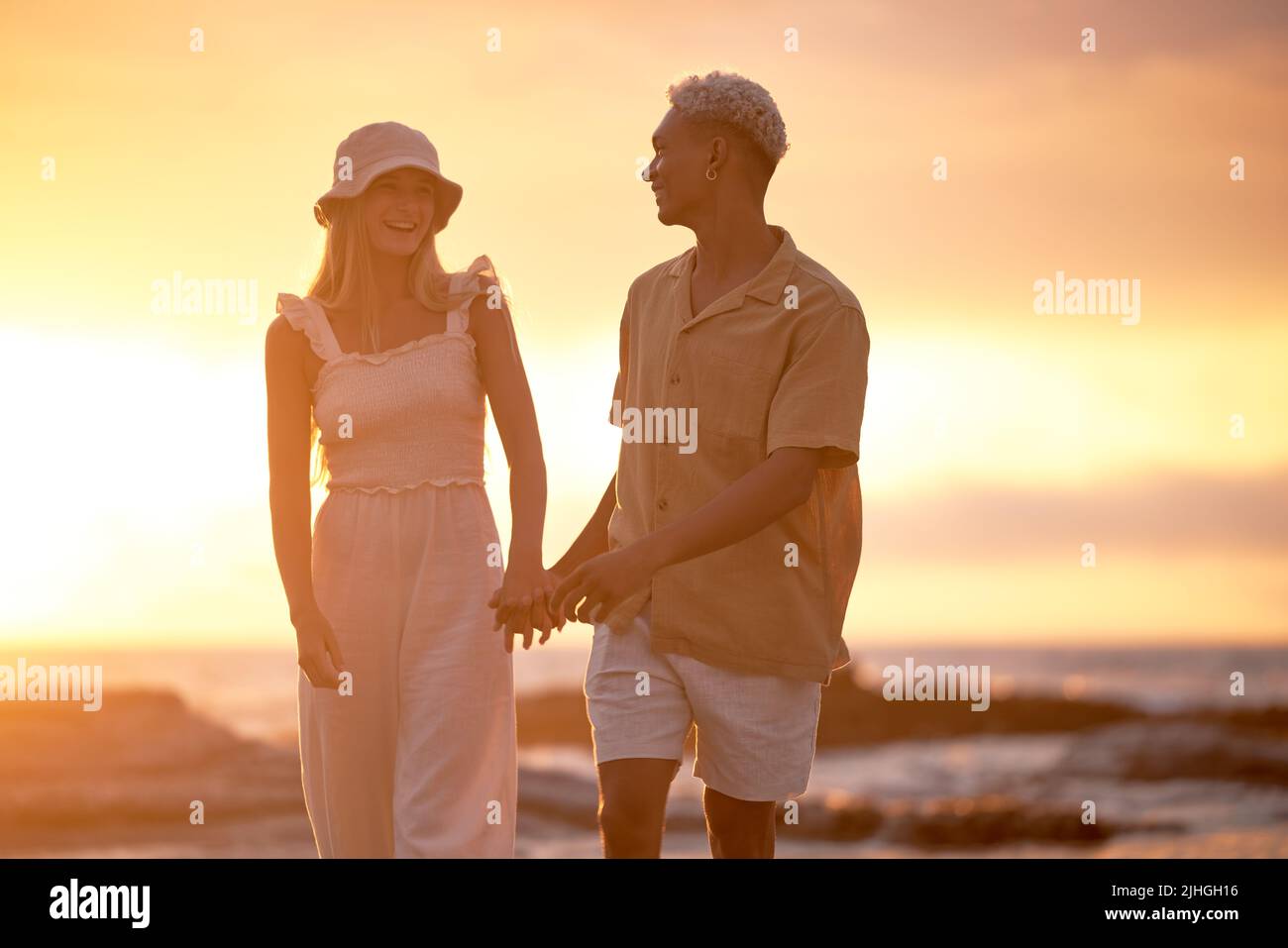 Closeup portrait of an young affectionate mixed race couple standing on ...