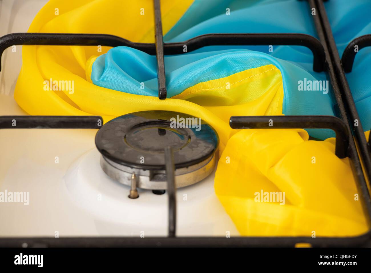 The Ukrainian flag lies on a gas stove in the kitchen in an apartment ...