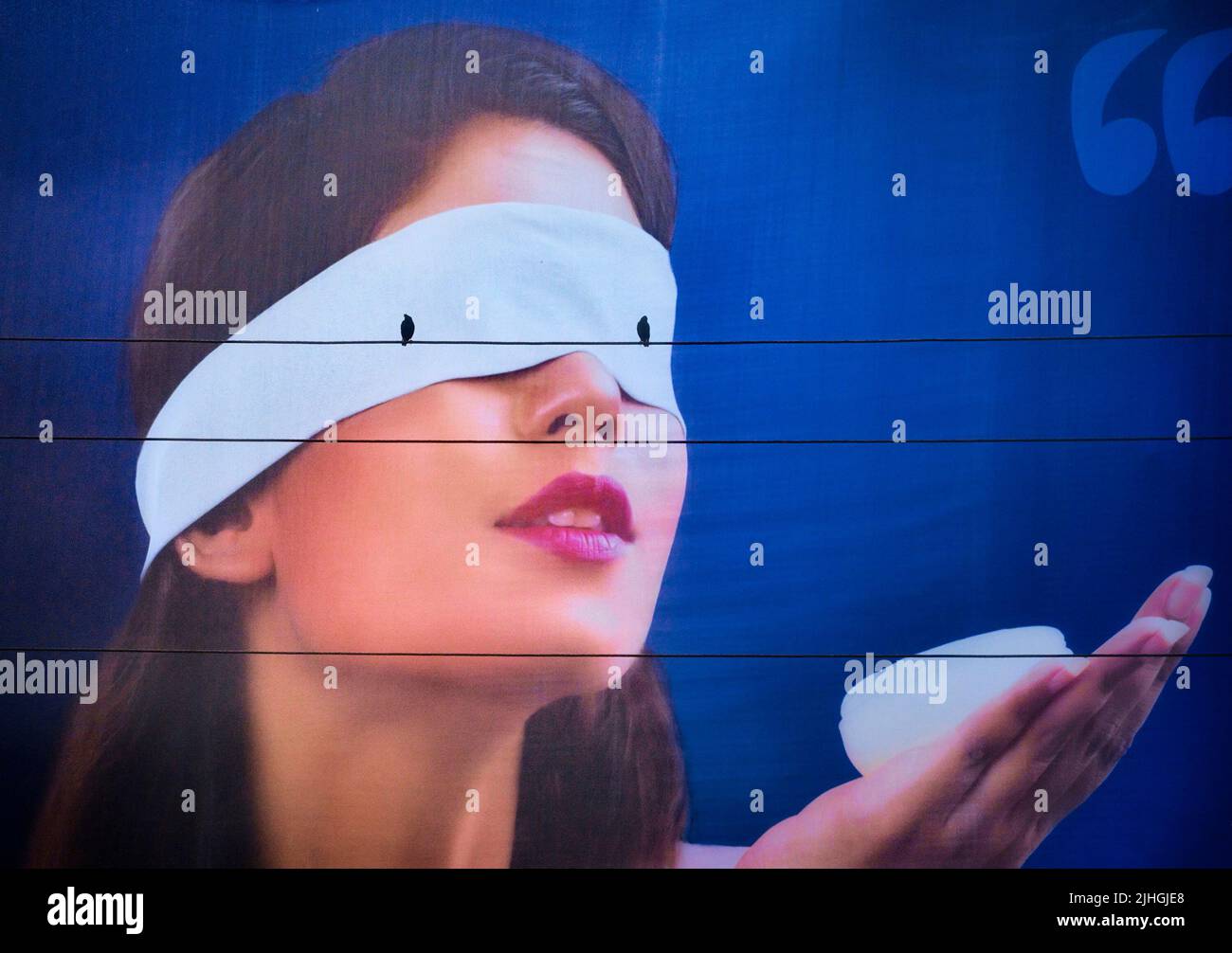 Birds appear to be woman's eyes on billboard, Bogra, Bangladesh Stock ...