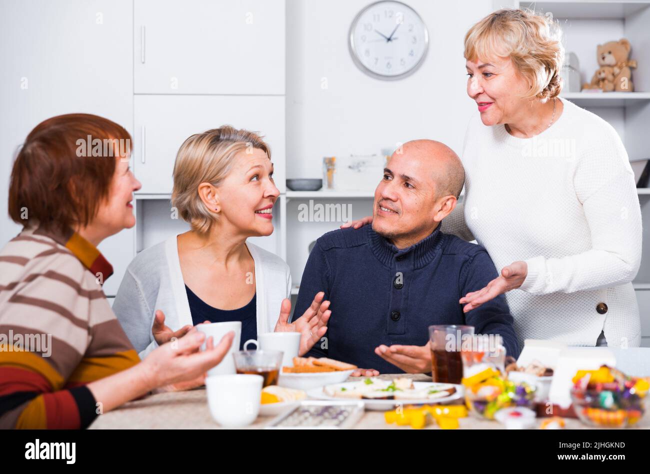 Mature women drinking tea together hi-res stock photography and images ...
