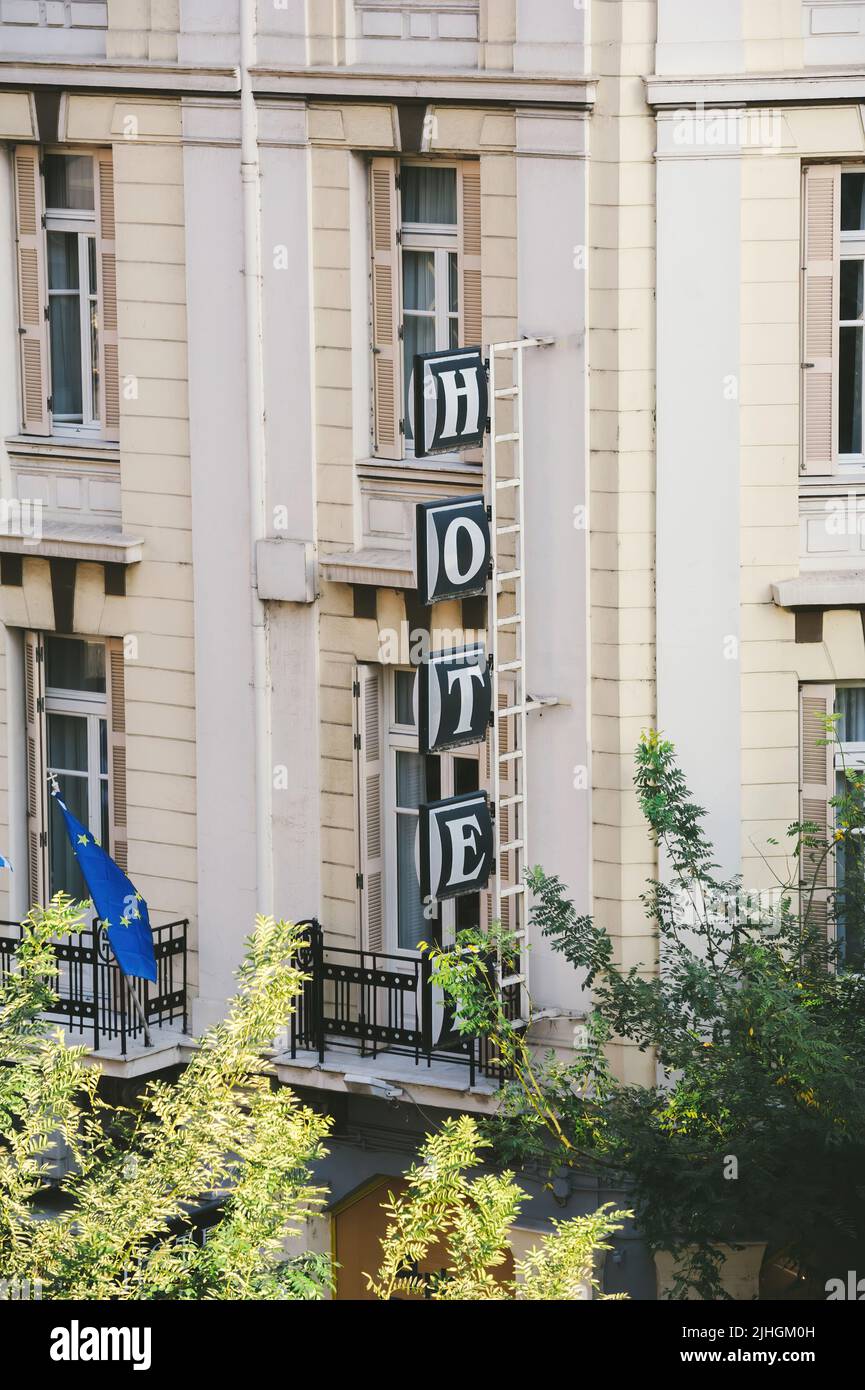 View from above of Hotel signage with European Union flag waving above ...