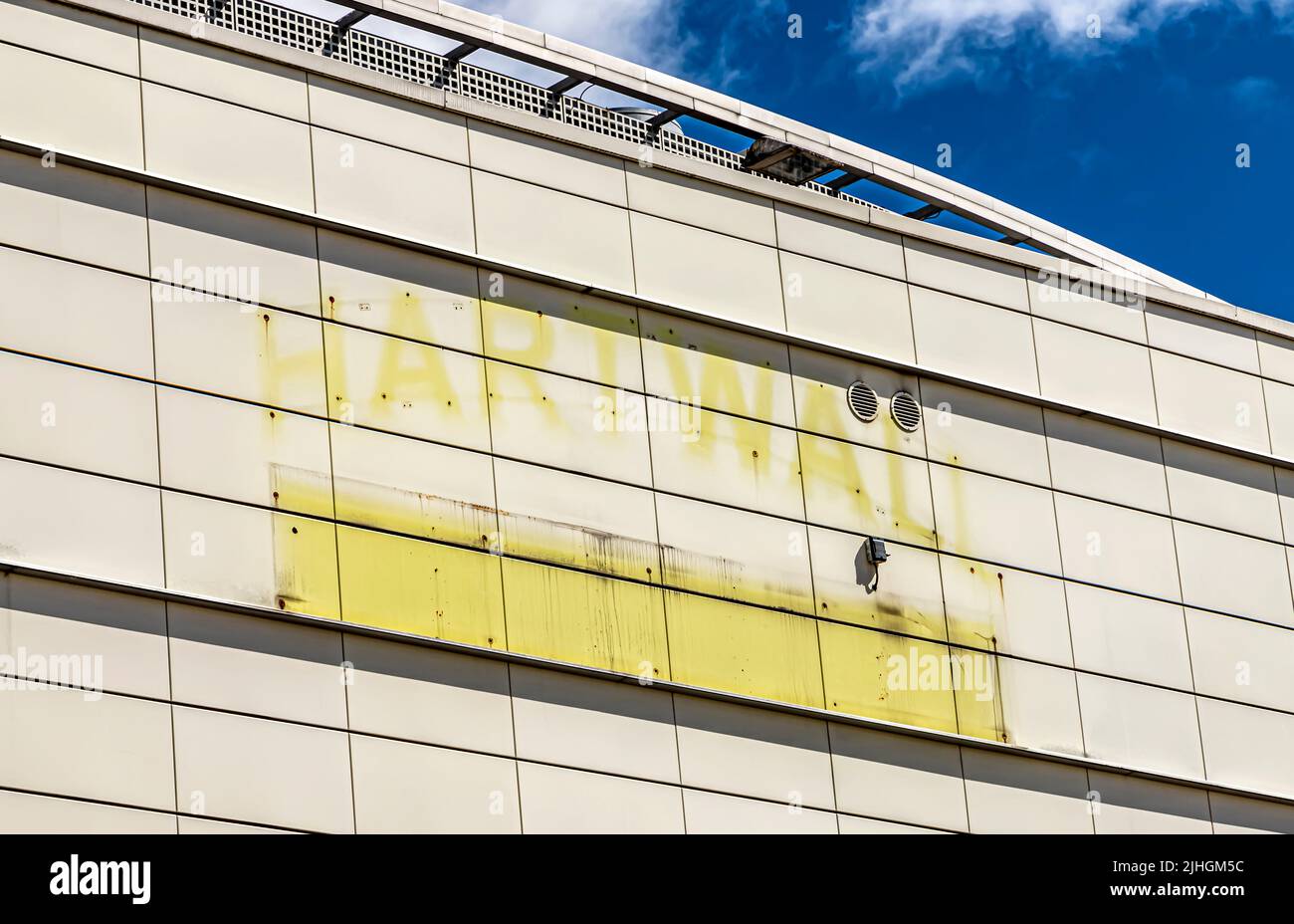 Marks left by a since removed sponsor neon sign on the external wall of ...